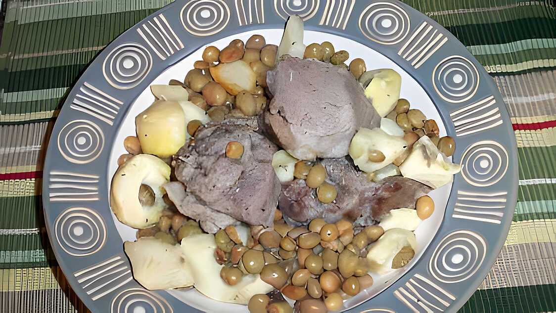 Recette de Tadjine d'agneau au petits pois et coeurs d'artichaux